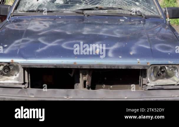 Holes on the windshield of the car, it was shot from a firearm. Bullet ...