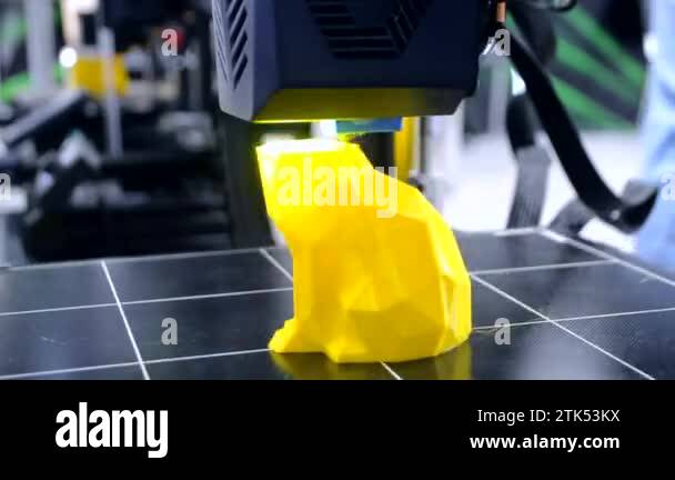Working 3D printer printing an object from plastic. Printing a model from molten plastic using a ...
