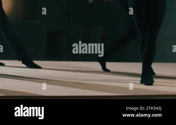 Unrecognizable actors and actresses in black costumes with white wrist ...