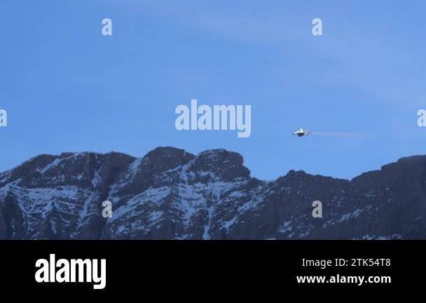 Fighter jet fires real shells from its cannon at a target on the ground ...