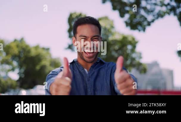Thumbs up, man excited about success and winner face outdoor, hand ...