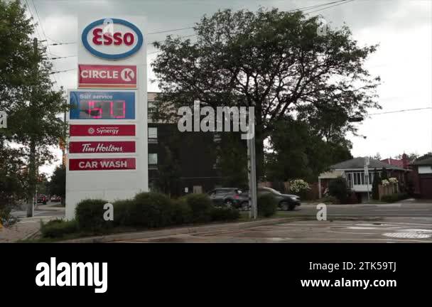 esso gas station logo at esso gas station atop price sign, blue oval ...