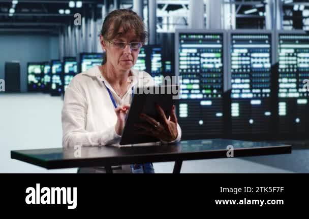 Competent tech support woman working in high tech space housing GPU ...