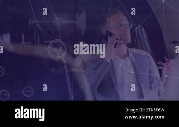 Animation of connected dots and graphs on caucasian business people ...