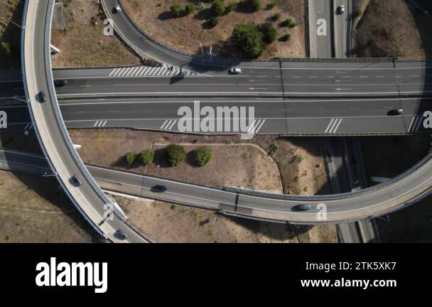 Aerial drone top down sideways panning of elevated highway junctions ...