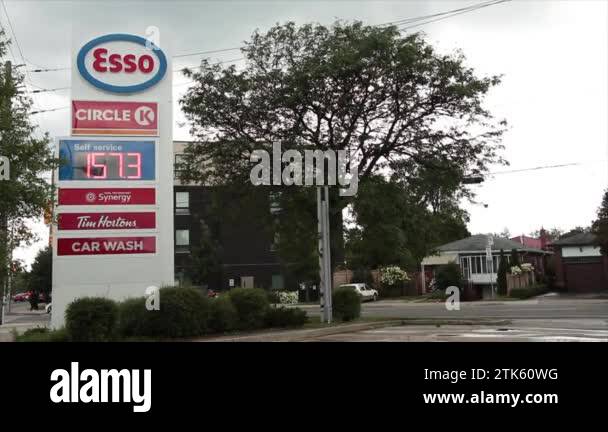 esso gas station logo at esso gas station atop price sign, traffic and ...