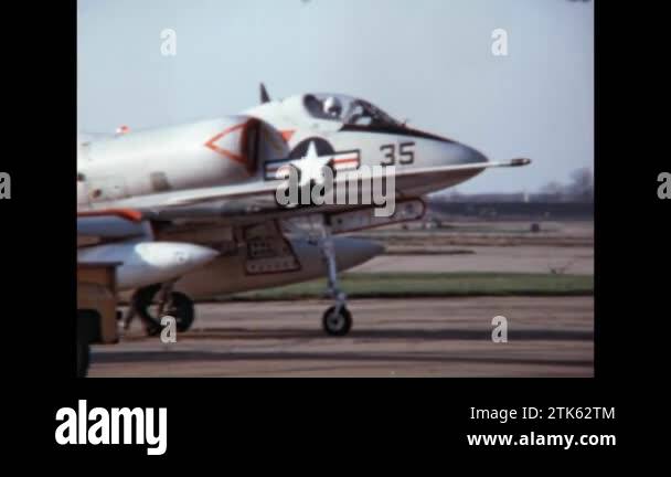 Military pilot in the cockpit of a vintage fighter jet preparing for ...