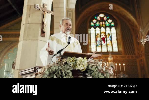 Faith, priest and man preaching in church on podium for support, trust ...