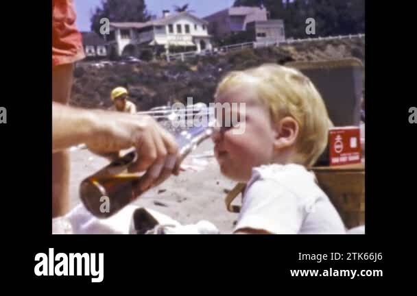 San Diego, United States June 1947: Child drinking soda from bottle ...
