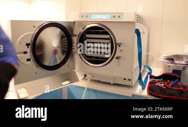 Disinfection of dental instruments in an autoclave. The process of using an autoclave to ...
