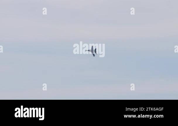 Isolated combat fighter jet military plane appears behind a mountain ...