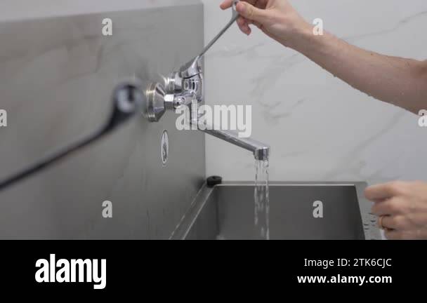 Disinfection procedure in clinic, surgeon washes his hands before ...