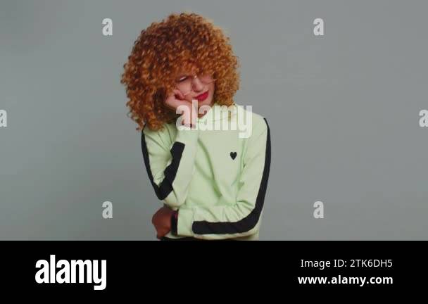 Dental problems. Young curly hair child girl kid touching cheek ...