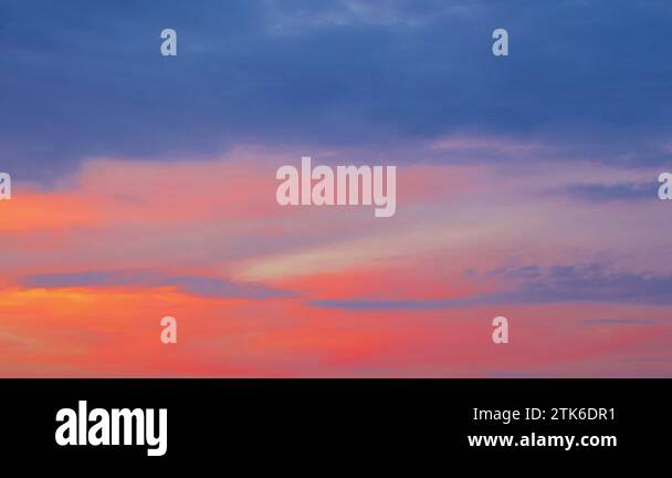 Sunset through the layers of clouds. Timelapse of clouds at sunset. 4K ...