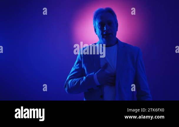 Heart attack. Stressed aged man. Neon light portrait. Worried male ...