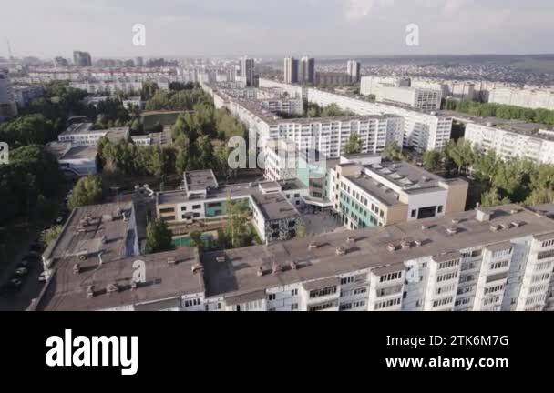 Modern school building in residential area among living houses. High ...