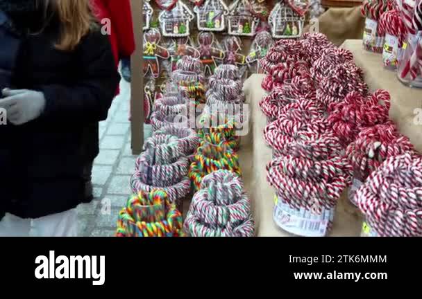 Outdoors, traditional meat dishes are cooked in a large frying pan at a ...