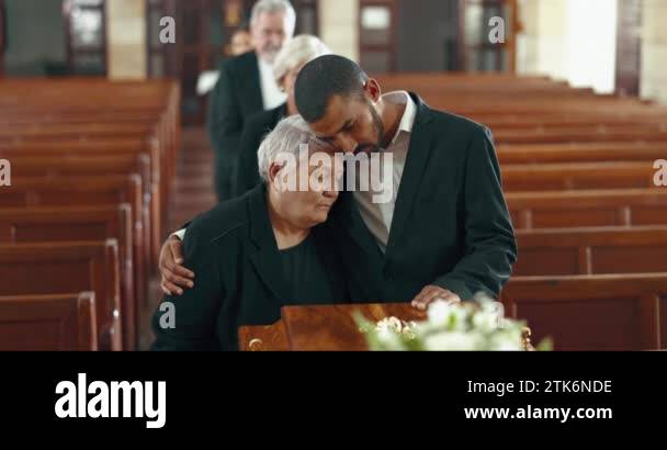 Church, funeral and senior mother and man hug for mourning death by ...