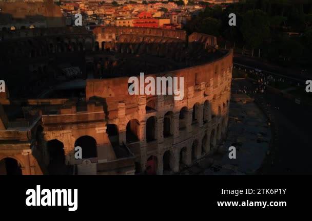 Sunset silhouette of the Colosseum, a majestic ancient amphitheater ...