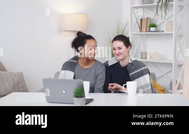 Close relationship. Female friends. Enjoying leisure. Smiling women leaning forehead sitting ...