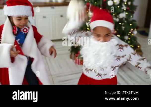 little children boy and girl have fun and dance against the background ...