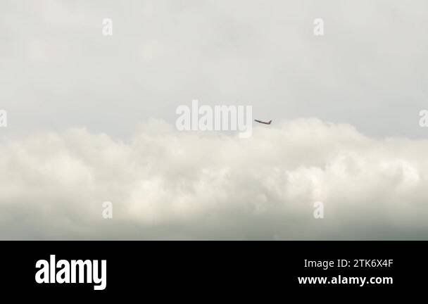 A passenger jet flying overhead on a beautiful clear day against a blue ...