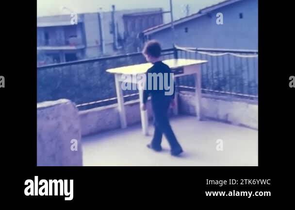 Palermo, Italy March 1970: boy with girl on the balcony of the house in the 70s Stock Video ...