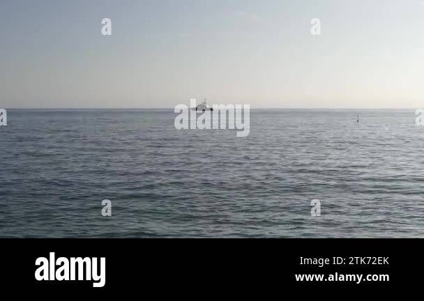 Sea view from the coast in the city of Nice. French Riviera. Horizon to ...