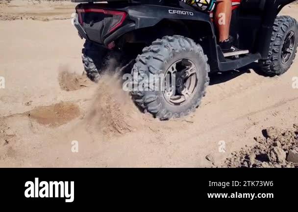 ATV skidding in the sand. Car tracks in sand. Sports UTV 4x4. Little ...
