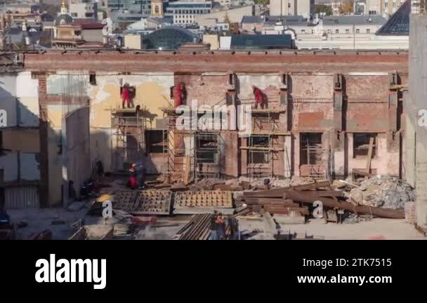 Bricklayers laying bricks to repair old walls timelapse with ...