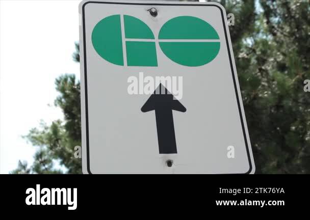 go train vertical rectangle sign logo with arrow pointing up with pine ...