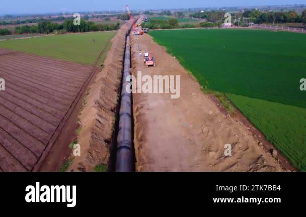 drone view of water pipeline with compaction machines construction ...