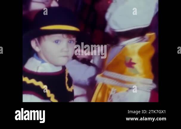 Palermo, Italy February 1970: children playing for carnival disguised as cartoon characters in ...