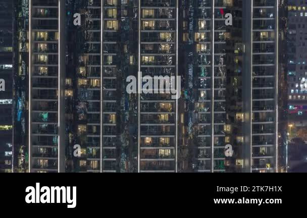 Windows lights in modern tower buildings timelapse at night. Multi ...