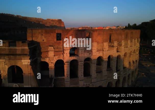 Sunset silhouette of the Colosseum, a majestic ancient amphitheater ...