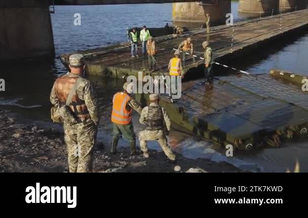 Pontoon bridge of the Ukrainian army. Installation of a temporary ...