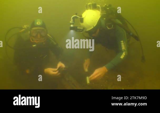 Underwater archaeological research: A scientist diver demonstrates ...
