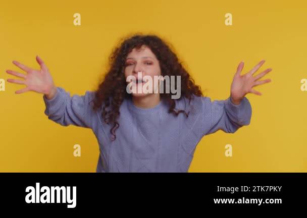 Wow. Hello, welcome. Curly haired woman appear from below waving hi ...