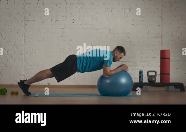 Personal sport trainings at home. Athletic male fitness coach doing ...