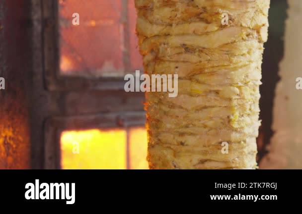Shawarma meat being cut before making traditional Turkish Doner Kebab ...