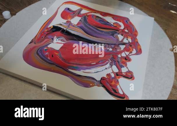 Painting with liquid ink. Abstract ink painting. The artist creates a ...
