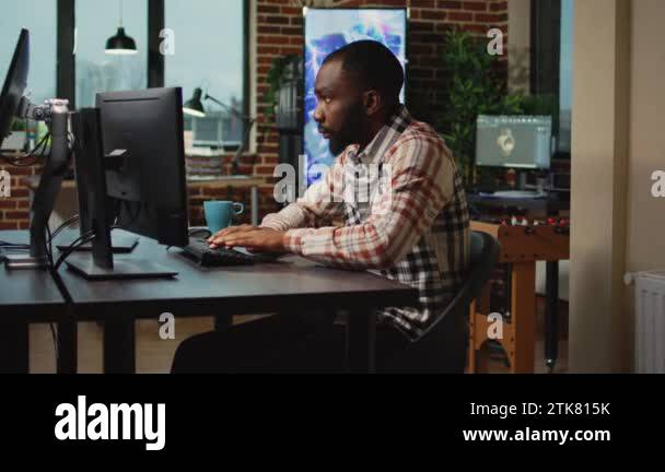 African american man working on 3d engineering or cgi using cad ...