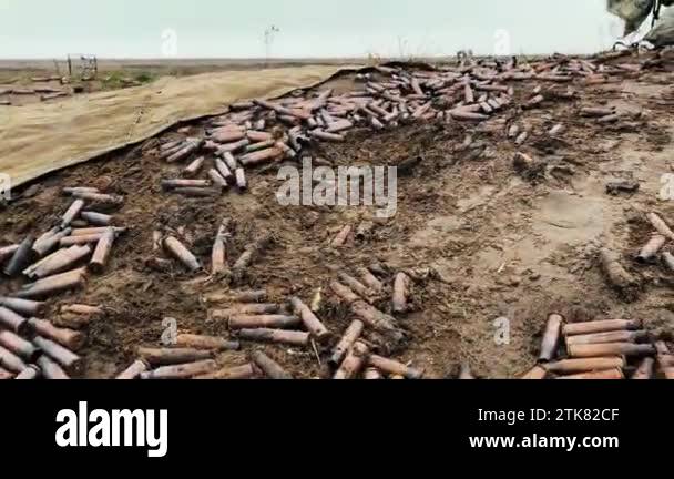 Lots of automatic weapon shell casings near sandbags. Brass and copper ...