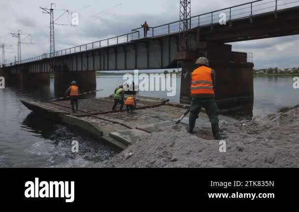 Pontoon bridge of the Ukrainian army. Installation of a temporary ...
