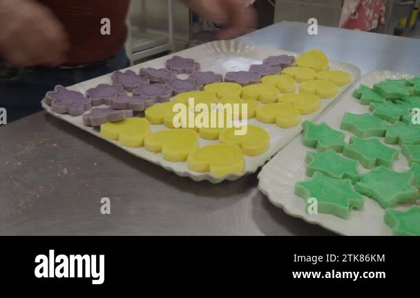 baker slicing red violet yellow and green star cloud and heart shaped ...
