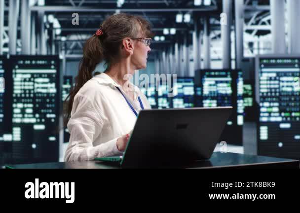 Trained mechanic working in high tech facility housing GPU dedicated ...