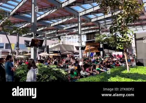 mexican fans in a plaza watching the soccer match, mexico supporting ...