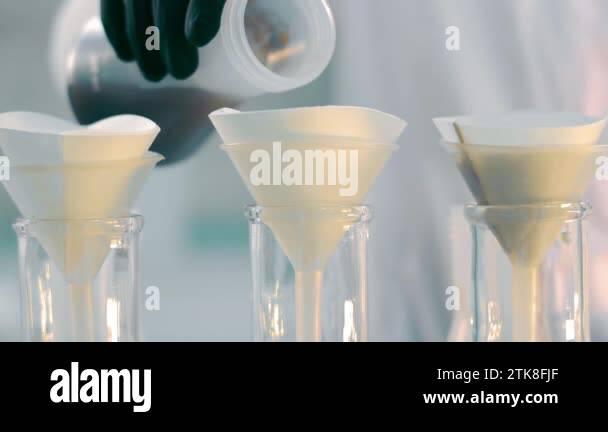 Filtration of raw water in the laboratory. Water pollution. Water ...