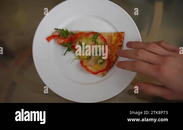 Close-up last piece of pizza with male hand stretching to food and ...