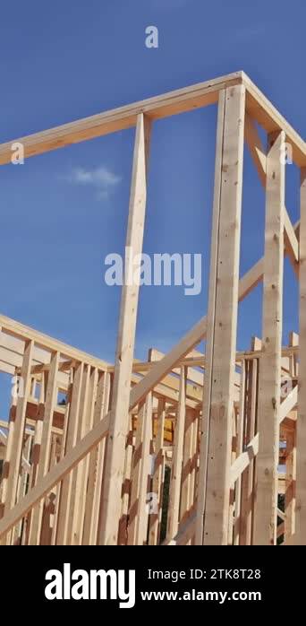 House with wooden framework frame is being constructed with support ...